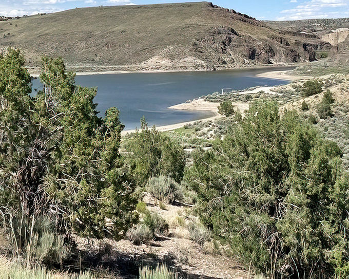 From this vantage point, the reservoir looks like a sapphire someone dropped among the sagebrush. Worth every step of the climb.