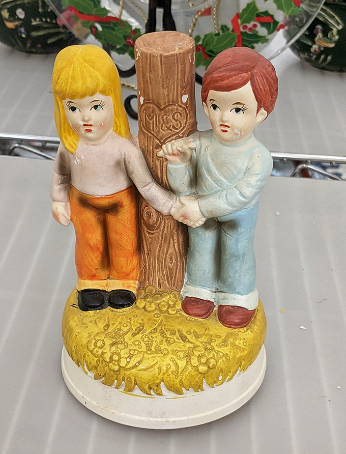 Vintage figurines like this charming pair tell stories of bygone eras—someone once cherished this, and now it awaits a new admirer.