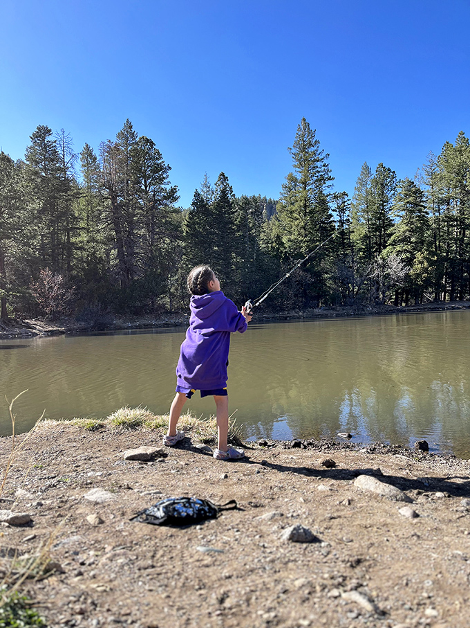 Future fishing champion or just enjoying the moment? Either way, this young angler has found the perfect classroom for life lessons.