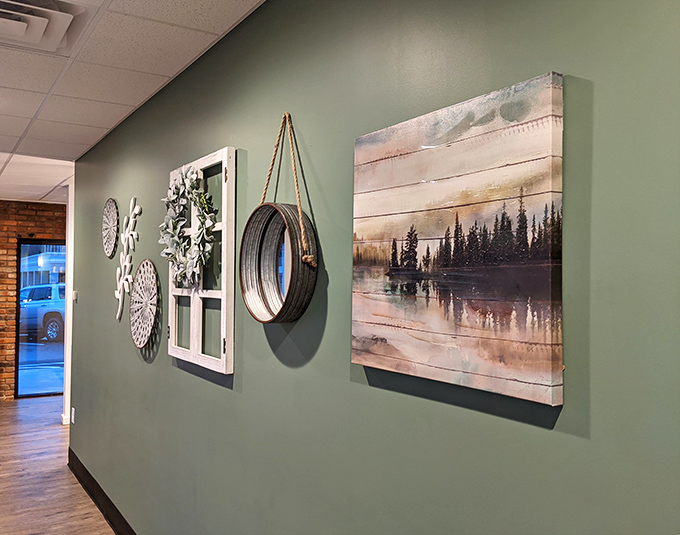 The wall d&eacute;cor strikes that perfect balance between "thoughtfully curated" and "not trying too hard," like someone with excellent taste who pretends they just threw it together.