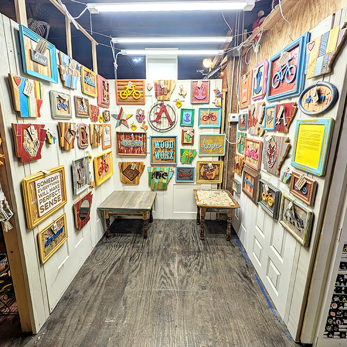 An art gallery within a flea market, where every wall-mounted piece tells you it's okay to be weird in the best possible way.