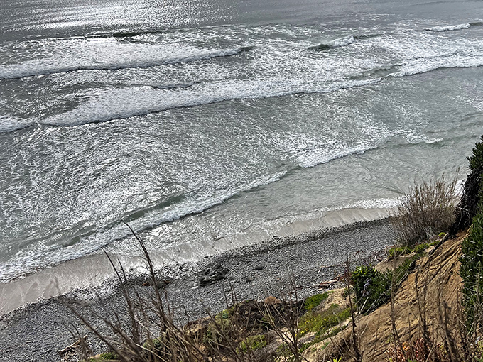 Silver waves ripple toward shore like mercury in motion. The Pacific puts on a different light show depending on the clouds above.