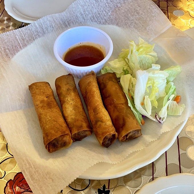 Crispy spring rolls arrive ready for their close-up, because even appetizers deserve their moment in the spotlight here.