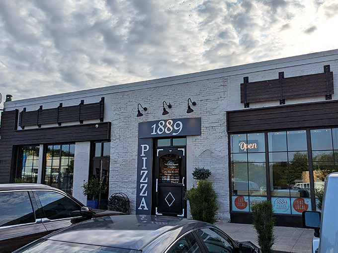 1889's striking white brick exterior is as clean and precise as their pizza philosophy. Modern design meets ancient tradition!