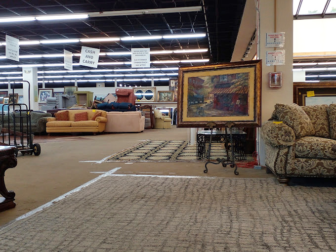 American Thrift's spacious interior showcases organized displays where furniture and household goods create a shopper's paradise.
