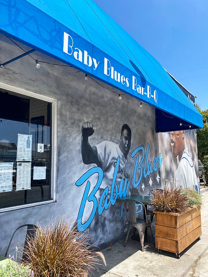 Baby Blues' vibrant blue awning and baseball mural bring Venice Beach flair to serious BBQ. Where sports legends meet legendary smoke.