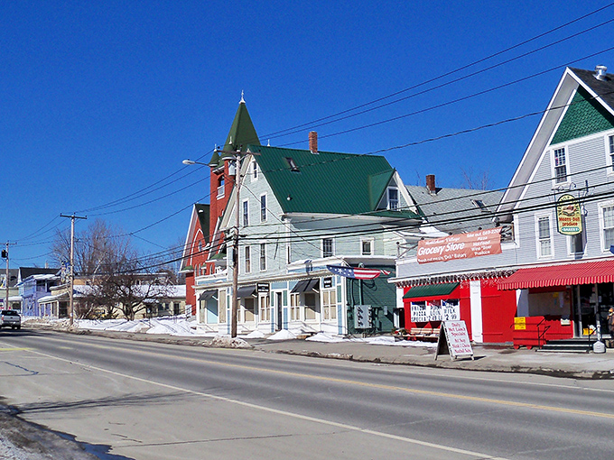 Winter's blanket transforms this main street into a scene worthy of a Currier and Ives print, complete with snow-capped charm.