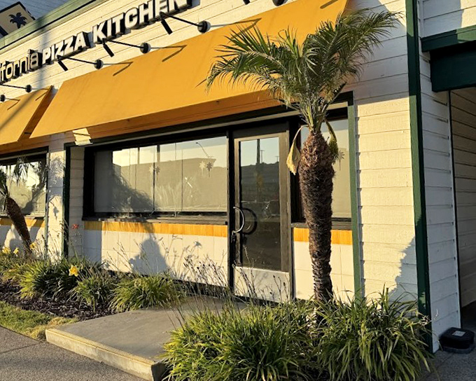 CPK's signature yellow awning and palm trees scream Southern California casual dining at its most innovative best. 