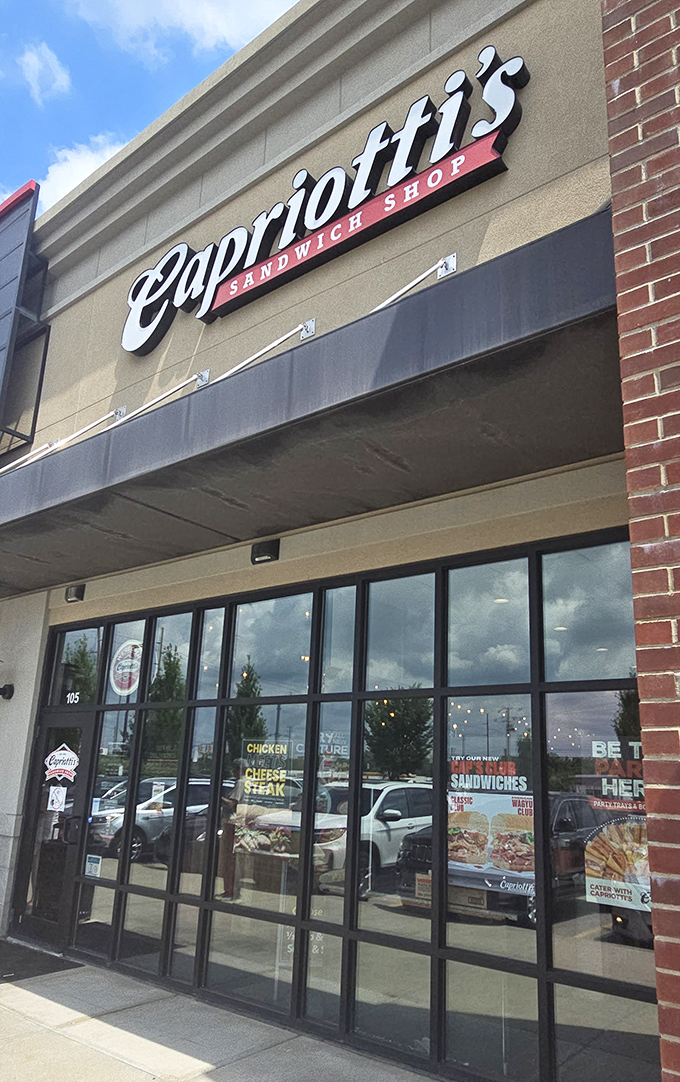 Sleek and stylish! Capriotti's modern storefront with its elegant script logo hints at the gourmet sandwich experience waiting inside this contemporary eatery.
