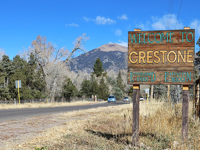 Crestone's welcome sign stands sentinel against mountain backdrops, announcing your arrival at 8,000 feet of spiritual elevation.