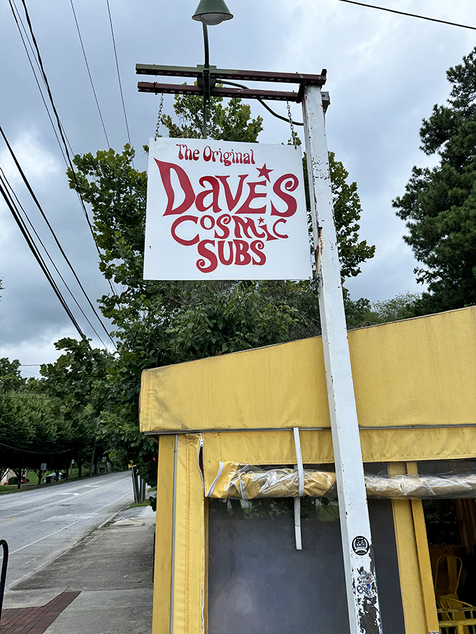 Dave's Cosmic Subs' vintage sign promises a groovy sandwich experience. This little yellow building houses flavor combinations that are truly out of this world.