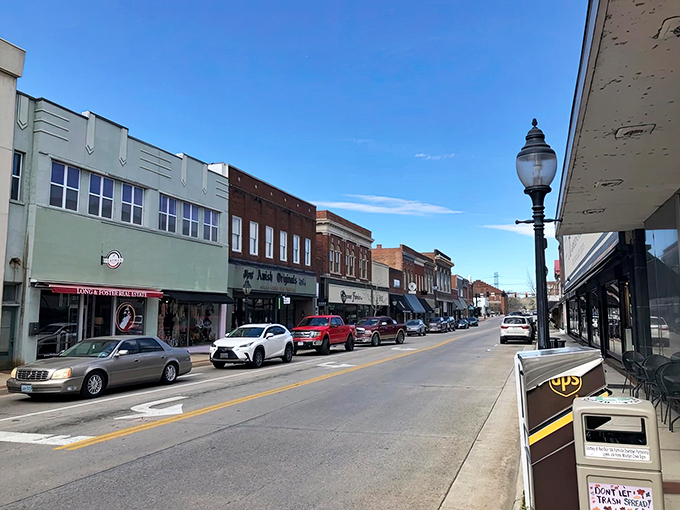 Farmville's restored downtown buildings house affordable shops and apartments. Brick facades with budget-friendly spaces behind them.