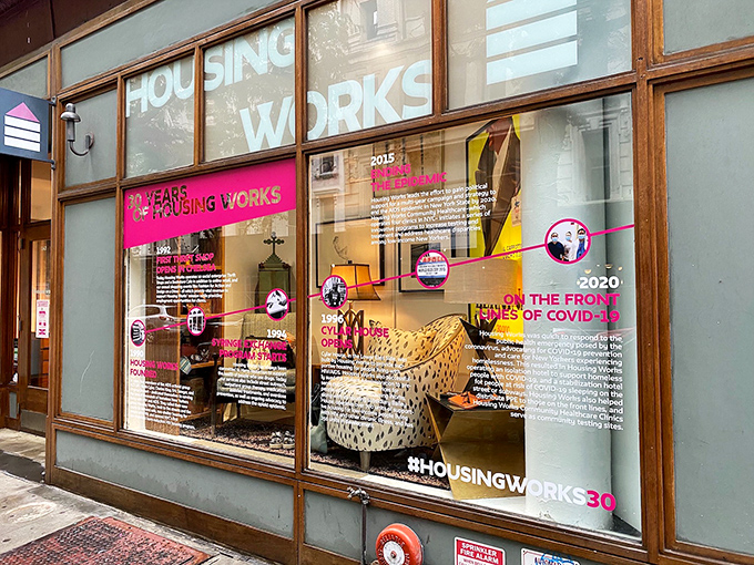 Housing Works: Thirty years of impact displayed in their window timeline. Shopping here isn't just retail therapy—it's community activism.
