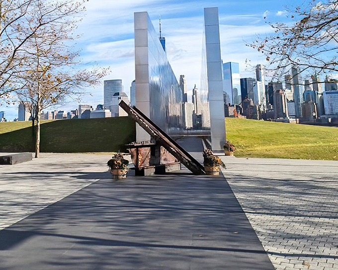 The 9/11 Memorial at Liberty State Park honors heroes while Manhattan's skyline stands as testament to resilience.