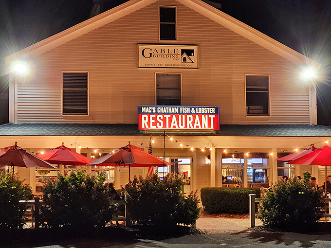 The red umbrellas provide shade, but the real relief comes from finally tasting their legendary lobster rolls.