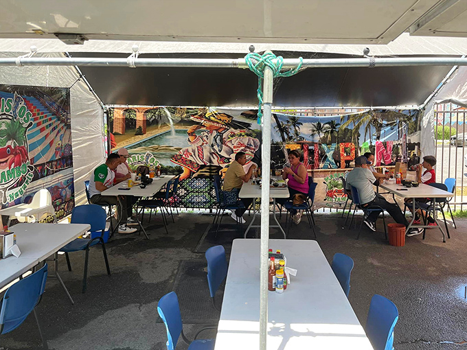 Bright blue tables under open sky - this is where authentic Mexican seafood meets California sunshine beautifully.