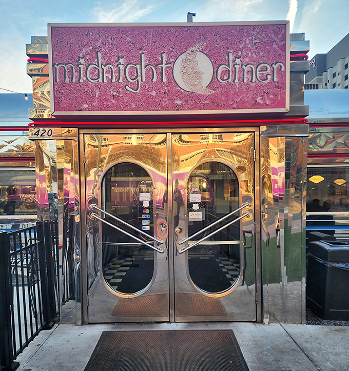 Midnight Diner's gleaming pink sign and chrome doors promise a 24-hour portal to comfort food nirvana. Urban dining with retro soul!
