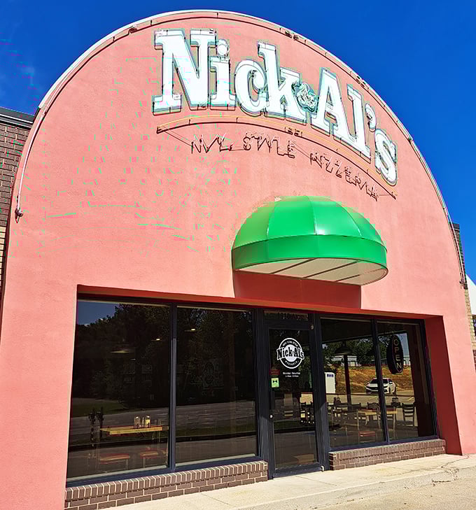 Nick & Al's pink palace stands proud like a flamingo among pigeons, serving authentic New York slices with Southern charm.