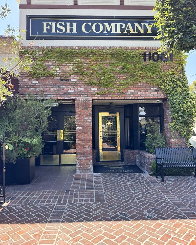 Original Fish Company's brick-and-ivy entrance promises seafood traditions honored through decades of delicious dedication.