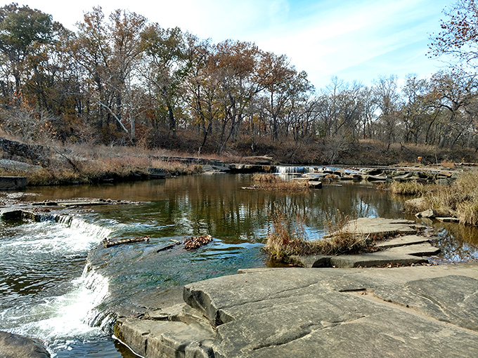 Gentle cascades create nature's own zen garden, where water whispers secrets to weathered limestone ledges.