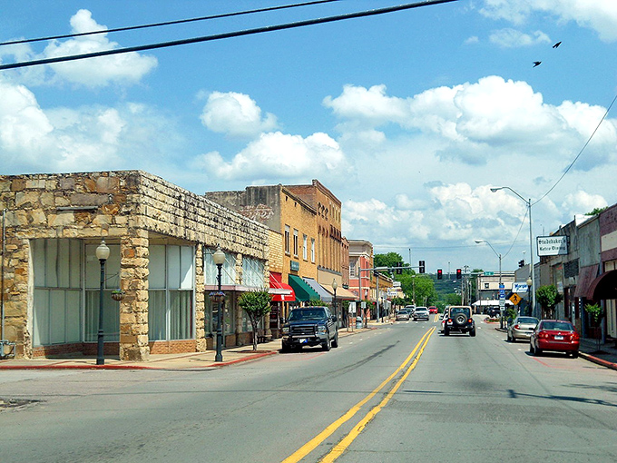 A sunny day in downtown Ozark invites visitors to stroll past local shops, historic buildings, and warm small-town charm.