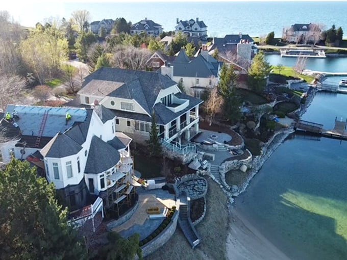 Petoskey from above: a tidy grid of affordable possibilities nestled between green hills and blue water. Your retirement dollars find breathing room here.