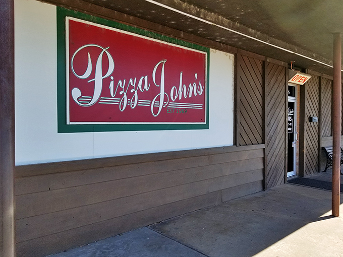 Pizza John's vintage sign has been guiding hungry folks to pizza happiness for generations. Retro pizza paradise!