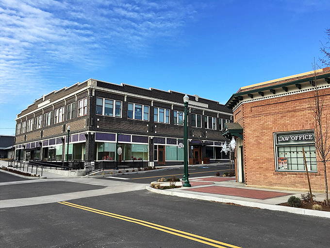 Rural charm meets natural beauty in Priest River, where white fences frame green pastures against mountain backdrops.