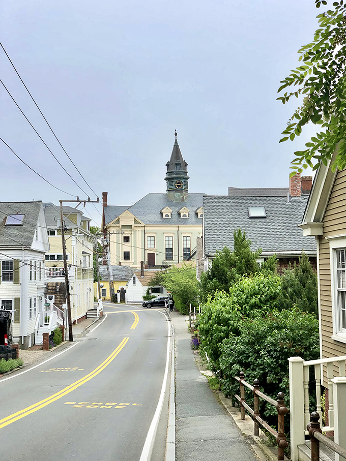 Provincetown's Commercial Street bursts with color and creative energy where rainbow flags fly and artistic spirit fills every corner beautifully.