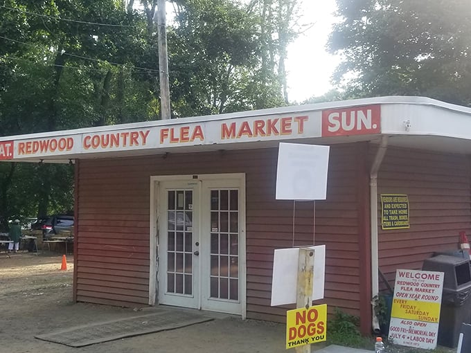 The rustic charm of this red building promises authentic country finds and friendly faces behind every booth door.