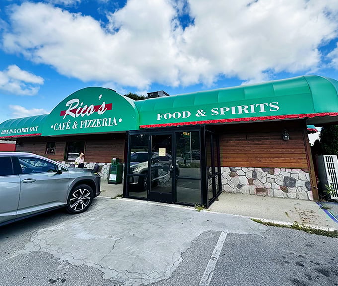 Rico's green awning welcomes hungry travelers to a roadside pizza oasis worth the journey.