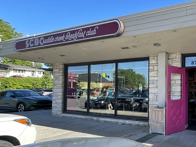 Modern stone facade promises elevated comfort food that respects tradition while embracing innovation.