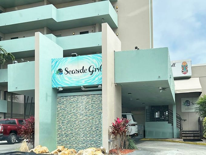 Seaside Grill's modern entrance might seem unassuming, but beyond those doors lies an Atlantic Ocean panorama worth finding.