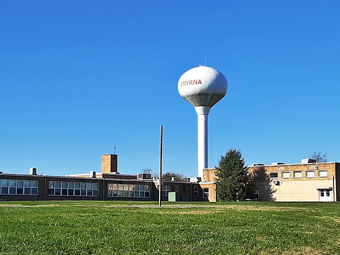 Smyrna's iconic water tower stands tall against the blue sky, like a sentinel watching over generations of small-town life.