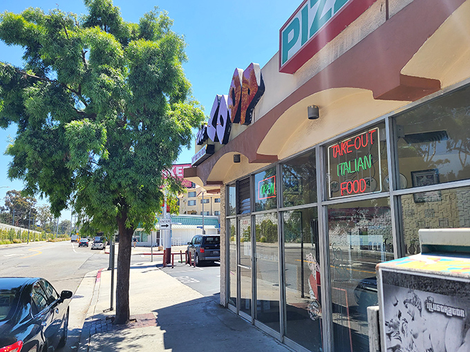 The Coop's strip mall location hides serious pizza credentials. Sometimes the best slices come from the most unassuming spots.