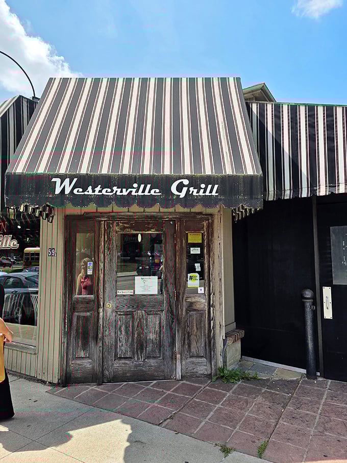 Weathered wood and vintage awnings tell stories of countless breakfast conversations and satisfied customers over time.