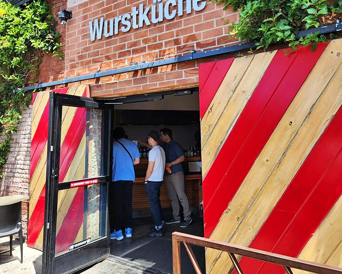 Wurstk&uuml;che's striking red and wood design hints at the exotic sausage adventures waiting inside this culinary playground.