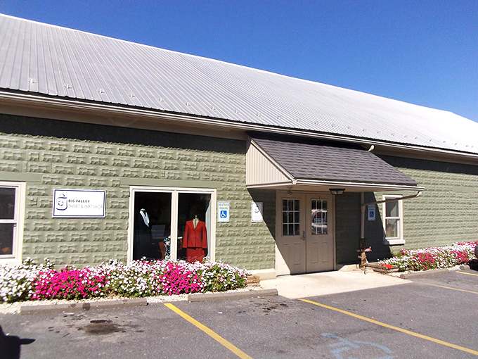 Big Valley entrance with flowers: "Blooming good deals! Seasonal flowers welcome shoppers to this charming country thrift destination."
