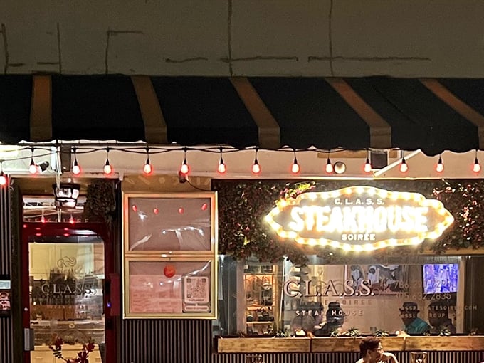 This charming streetside setup proves great steaks taste even better under the Florida stars.