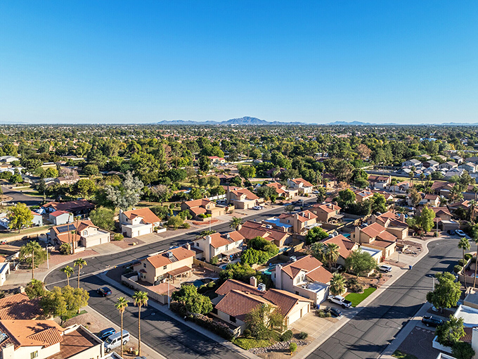 The geometric precision of Chandler's neighborhoods creates a satisfying pattern from above, like someone carefully arranged the homes for maximum aesthetic appeal.