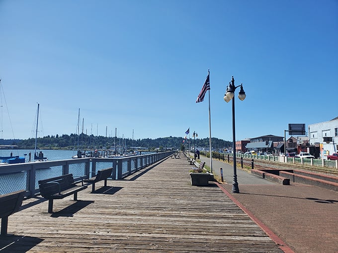 The boardwalk at Coos Bay offers front-row seats to maritime life and spectacular coastal sunsets.