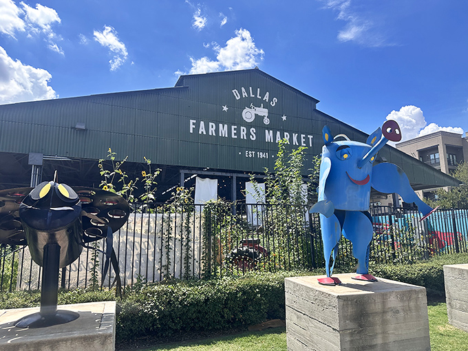 The iconic Dallas Farmers Market entrance, complete with vintage red tractor, welcomes visitors to this urban food paradise.