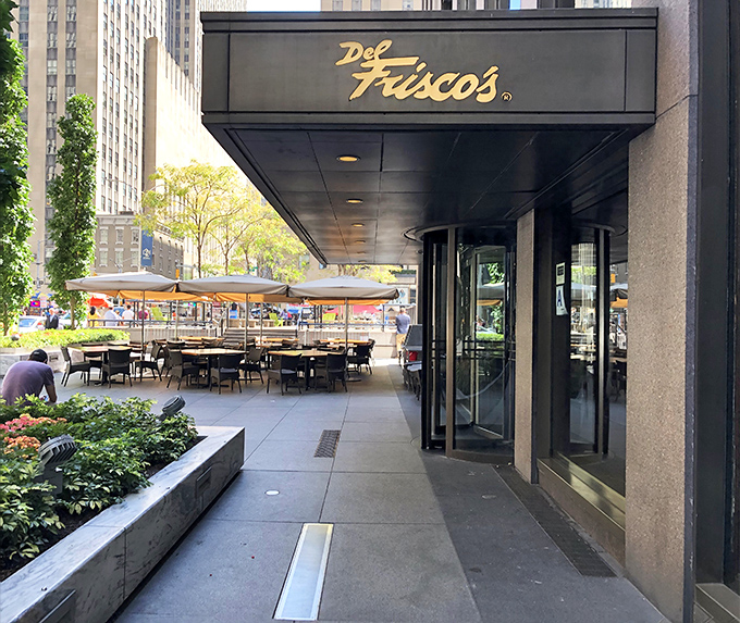 The sleek outdoor seating at Del Frisco's offers a front-row seat to Midtown's hustle while you savor beef perfection.