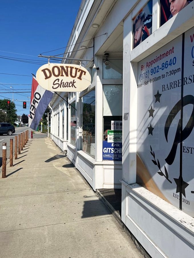 The classic Donut Shack sign against a blue sky &ndash; where time stands still and calories don't count (at least that's what we tell ourselves).