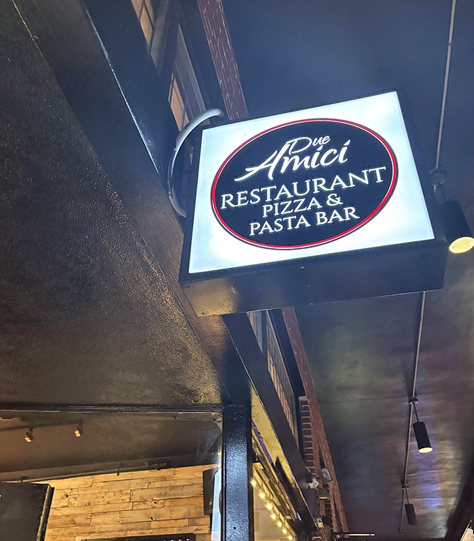 A simple sign marks the spot where pizza dreams come true at Due Amici. Sometimes the best flavors hide in plain sight.