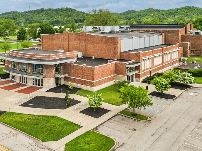 Small-town architecture stands proud against rolling hills, creating postcards that write themselves naturally.