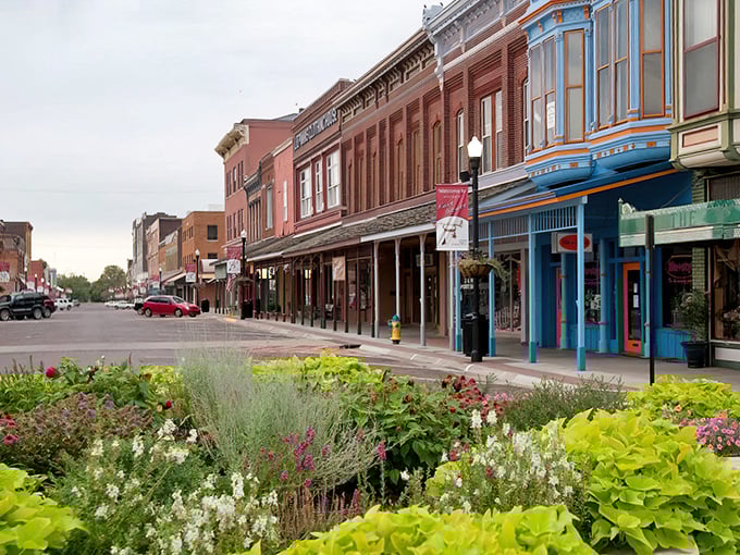 Vibrant gardens frame Fort Scott's colorful storefronts, creating a retirement paradise where your Social Security check buys both necessities and beauty.