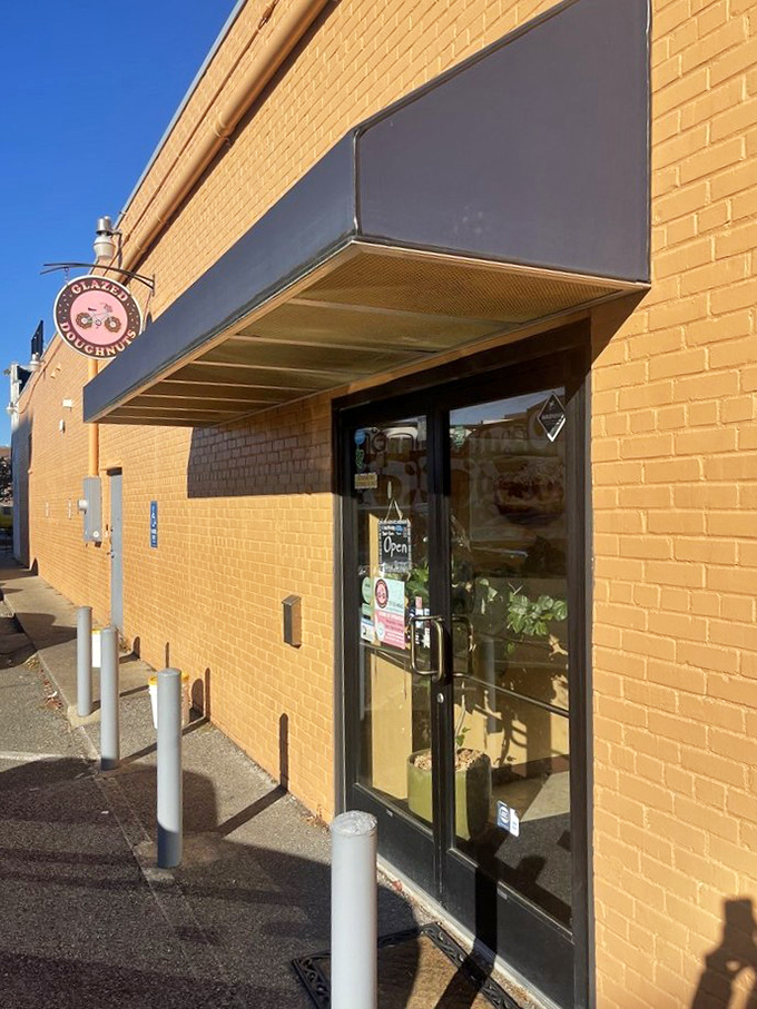 That simple hanging sign at Glazed Doughnuts is like a secret handshake. Donut connoisseurs know what treasures lie within!
