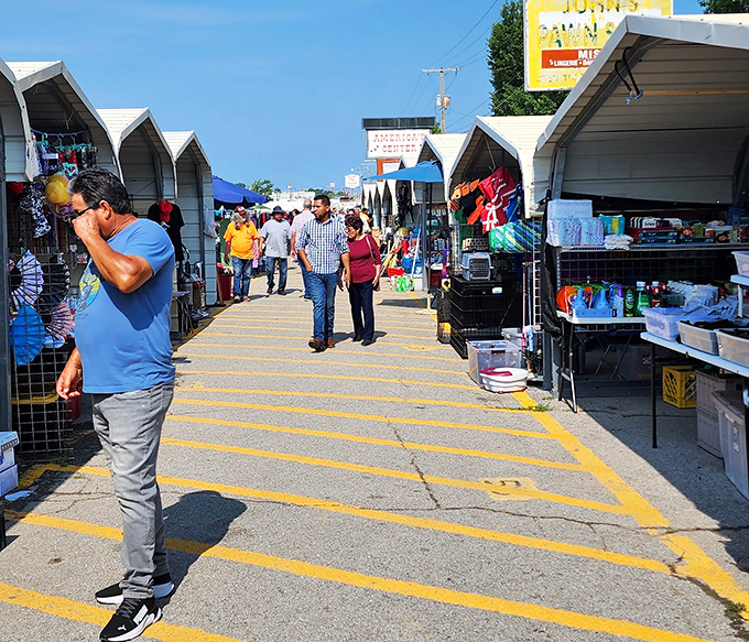 Covered stalls protect treasures and shoppers while maintaining that authentic flea market energy.