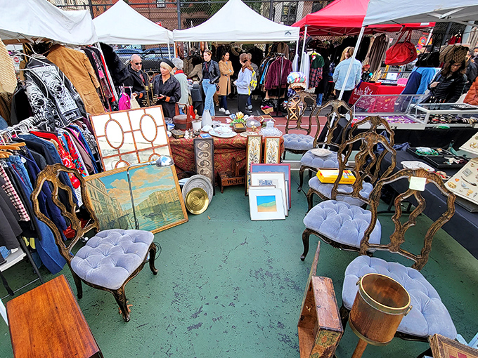 Vintage furniture sits patiently under tents, waiting for the right home to complete.